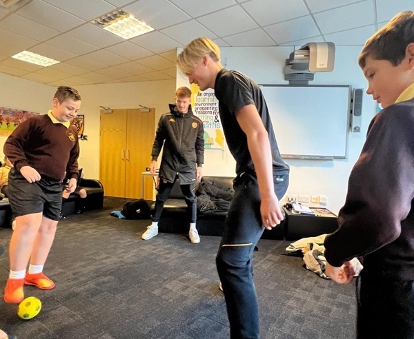 It’s a goal! Hull City apprentices join forces with Run With It Charity